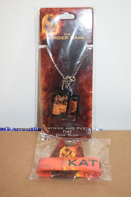 NECA THE HUNGER GAMES Katniss & Peeta Fire Dog Tags & Katniss Rubber ...