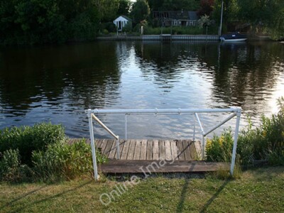 Photo 6x4 White Jetty on the Thames Staines The riverside houses here ...