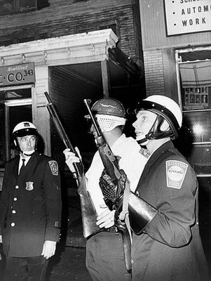 Boston police officers riot helmets carrying guns stand a str- Boston ...
