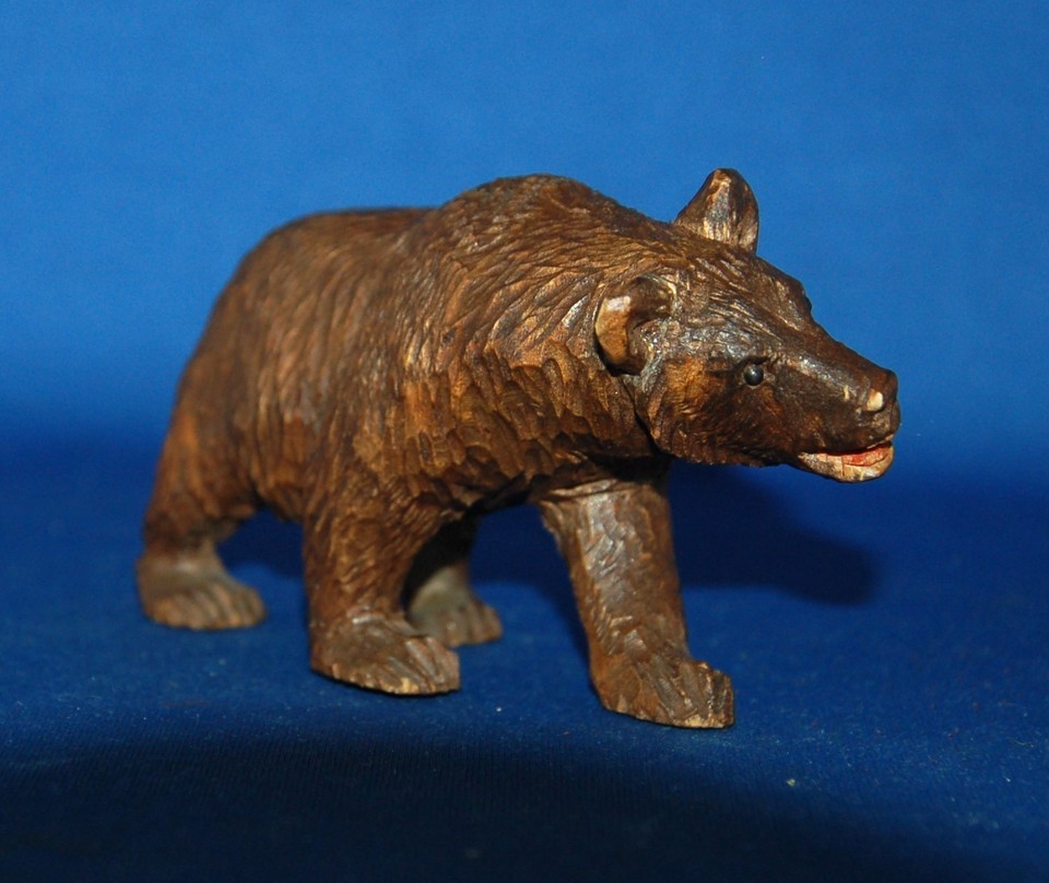 A 19th century Black Forest prowling bear figure, well carved, antique ...