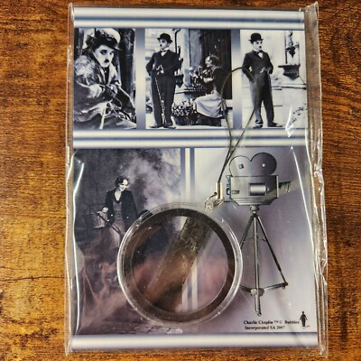 charlie chaplin vintage film cells. strip inside round case, photo ...