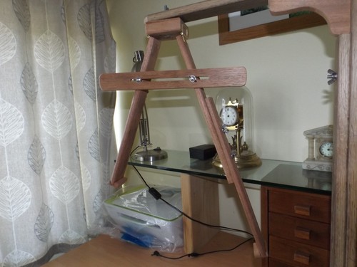 Repairers cuckoo clock stand for final adjustments testing time chimes ...