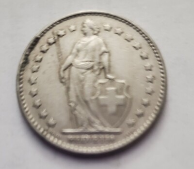 1977 1 FRANC HELVETIA STANDING WITH SPEAR AND SHIELD SURROUNDED IN ...