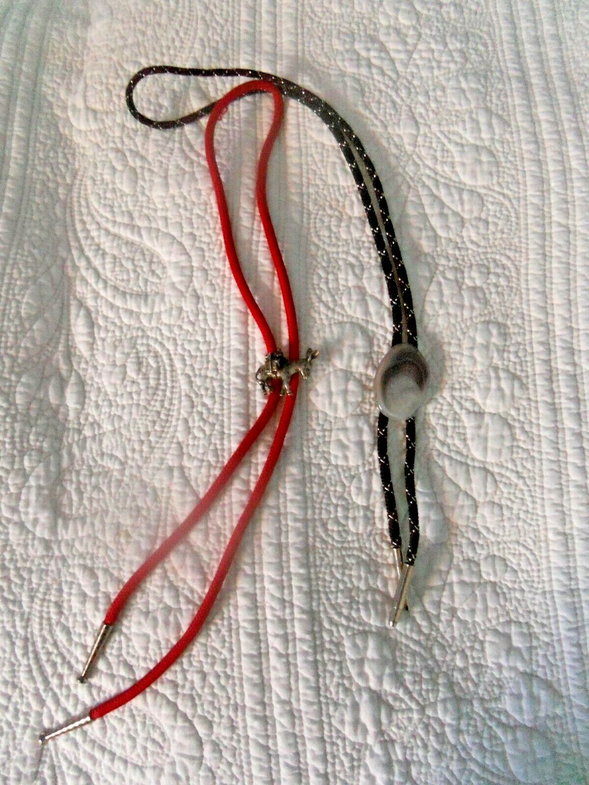 2 Mens Bolo ties with bullet ends. One has a donkey and the other cross ...