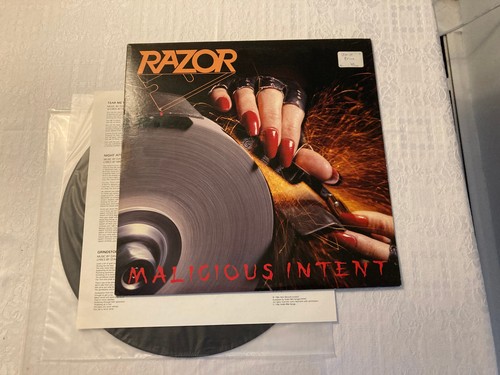 RAZOR Malicious Intent ℗1986 Attic Recs / ©1986 Snake Bite Songs ...