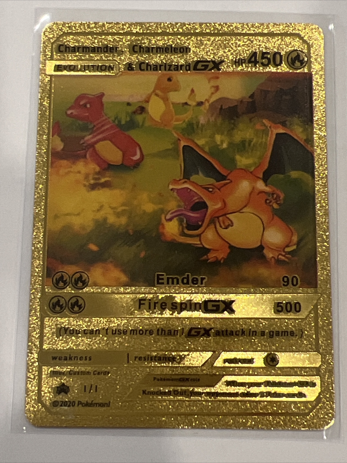 Gold Charmander, Charmeleon, And Charizard GX With Plastic Cover On It ...