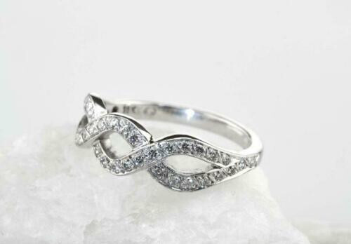 Classic Infinity Design With Round Shiny White Gemstone Engagement ...