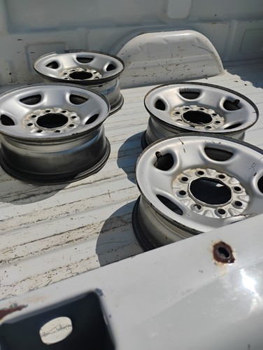 2004 Chevy 2500 rims, 16 inches in diameter, silver, slight surface ...