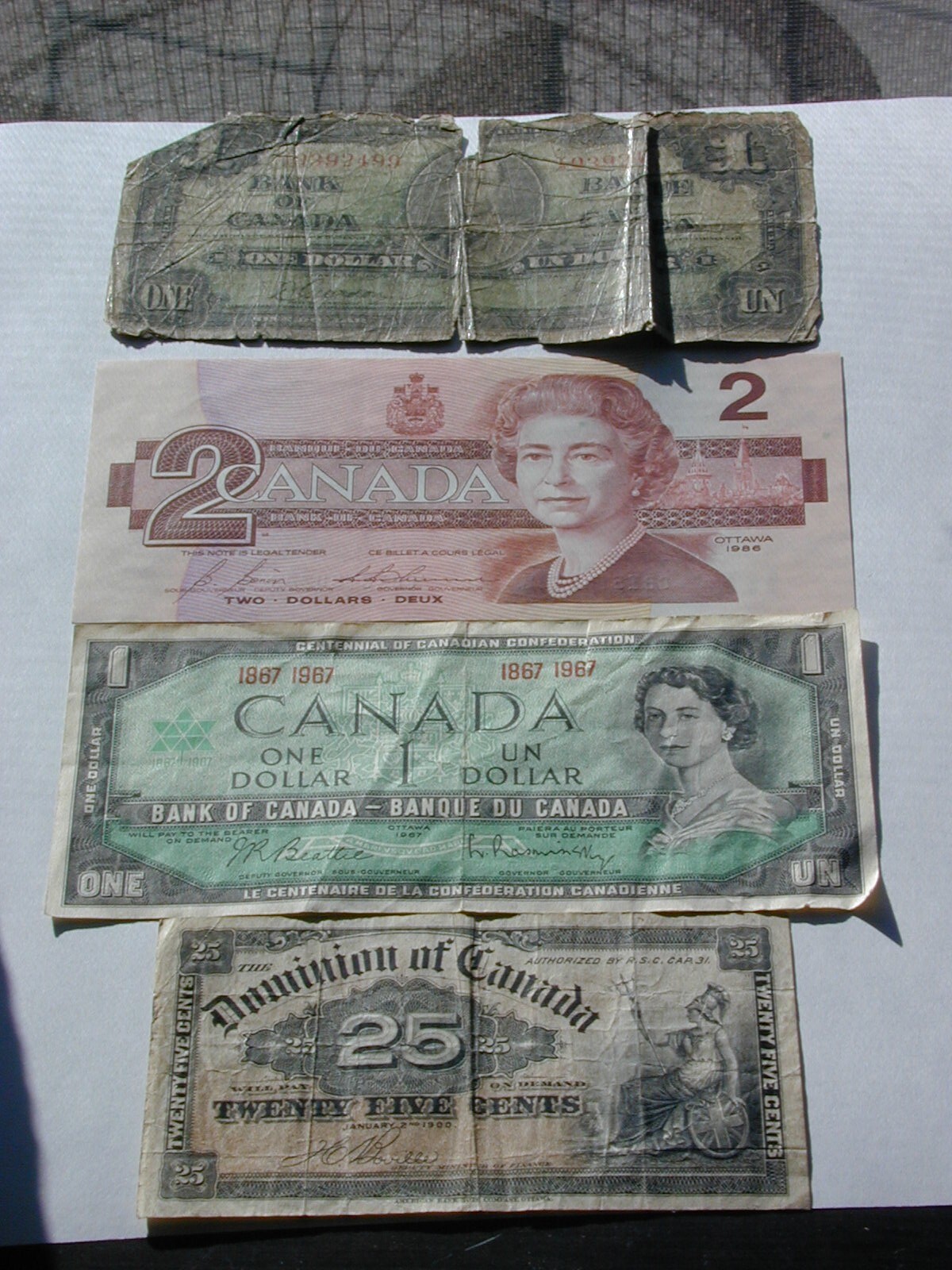 4 CANADA BANKNOTES 1900 25 CENTS, 1986 $2 UNC, 1967 CENTENARY, 1937 $1 ...