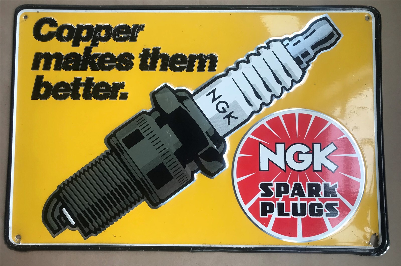 NGK Spark Plugs tin metal advertising embossed sign "Copper Makes Them ...