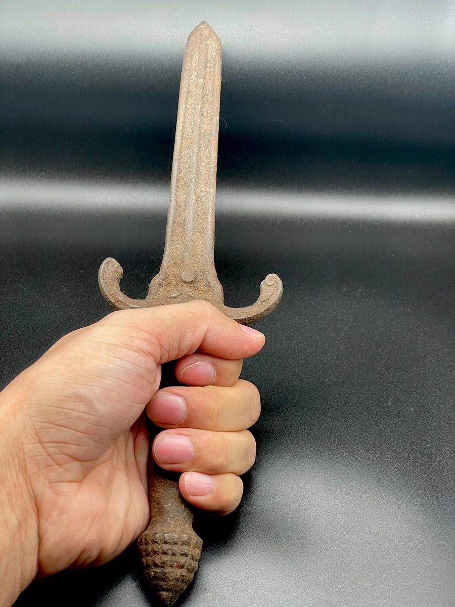 Holding An Old Dagger