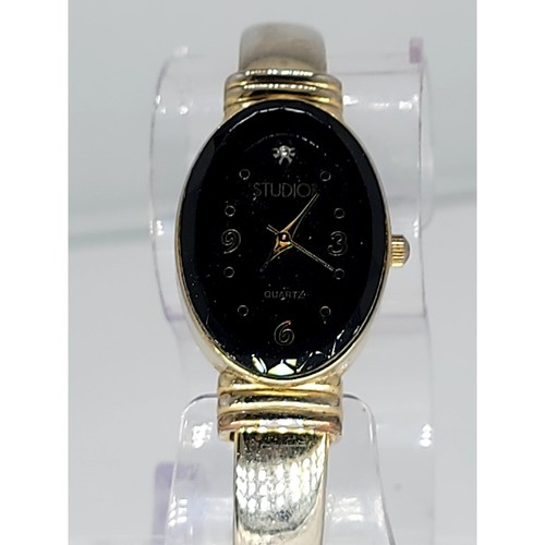 Vintage Studio Quartz Womens Gold Tone Cuff Bracelet Watch Black Oval ...