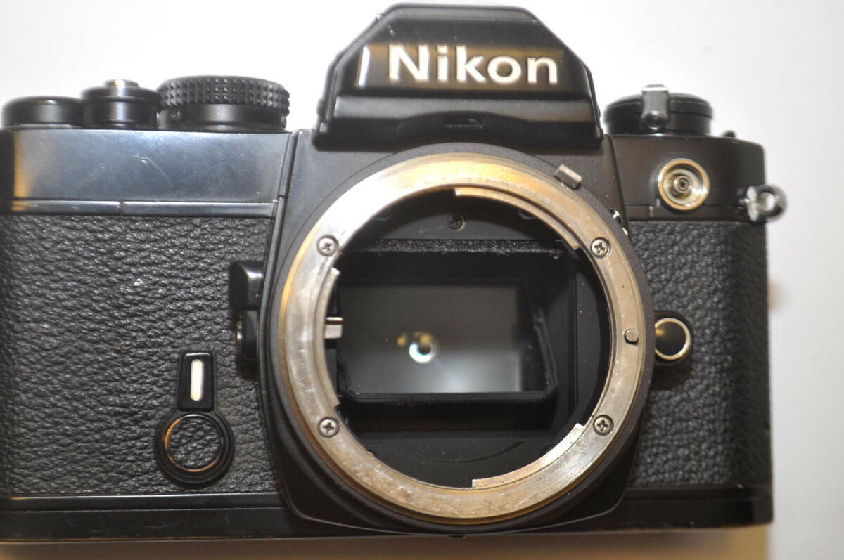 Nikon FM Black 35mm SLR Camera w/ Ai Nikkor 50mm F/1.4 & 70 Nikon FM Black 35mm SLR Camera w/ Ai Nikkor 50mm F/1.4 & 70