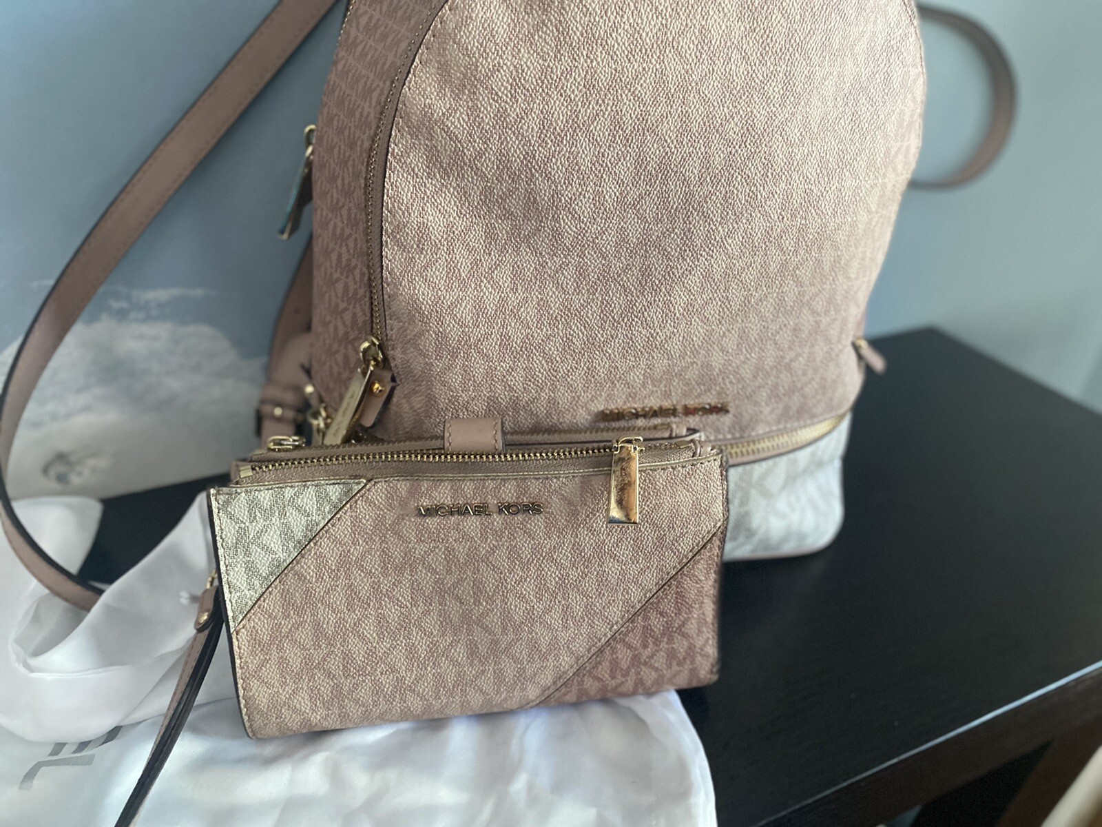 Rhea Logo Embossed Faux Leather Backpack at Walter Reece blog