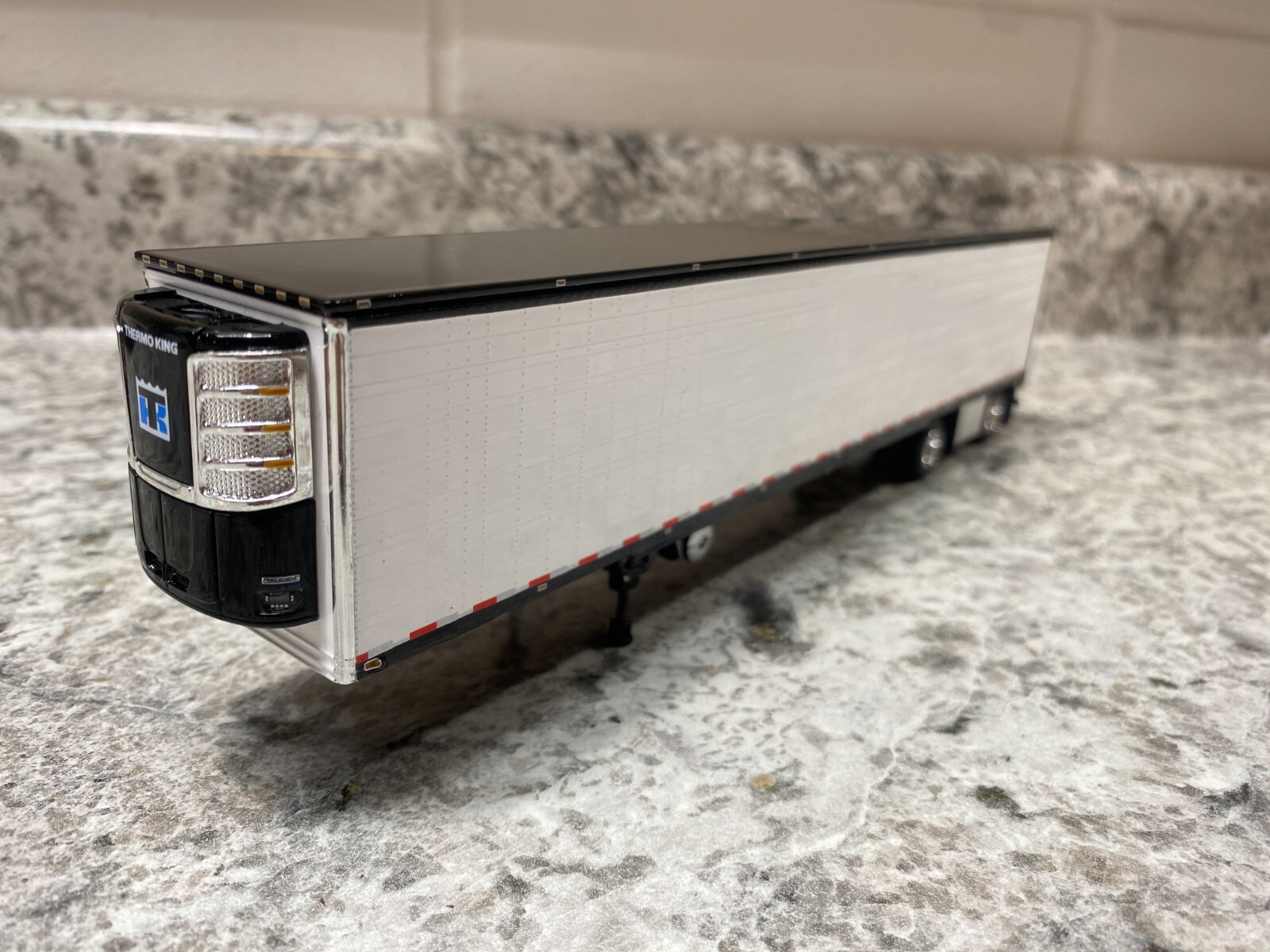1/64th scale DCP 53' reefer trailer. white/black with burgundy stripes ...