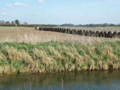 Photo 12x8 Rolls of straw on the edge of Babingley River Farmland ...