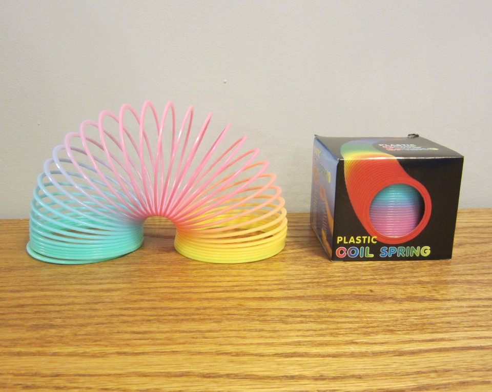 7 NEW MAGIC GLOW IN THE DARK COIL SPRINGS MULTI COLORED 3" PLASTIC COIL ...