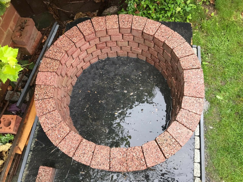 rounded fire pit kit brick Fireplace concrete stones log burner wood ...