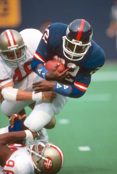 Lee Rouson New York Giants gets tackled by Tom Holmoe and Da Football ...