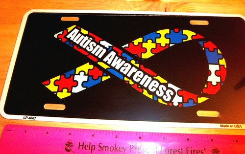 Autism Awareness metal license plate with colorful puzzle piece ribbon ...