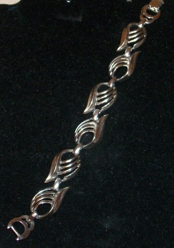 SILVER INTERLOCKING SWIRLS BRACELET pre-owned | eBay