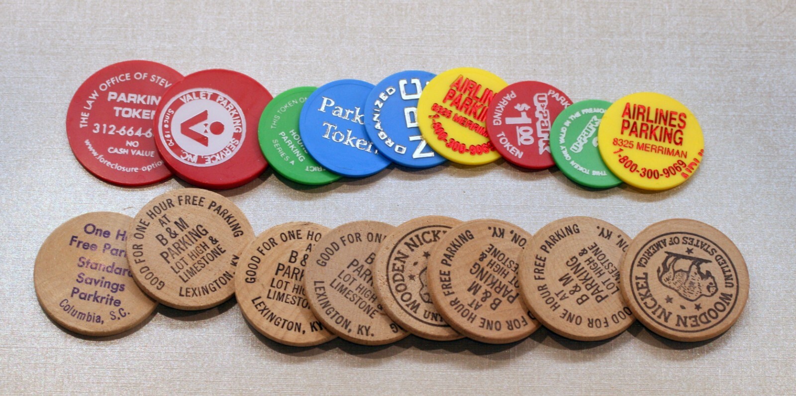 Group of 17 plastic & wooden parking tokens - various states and ...