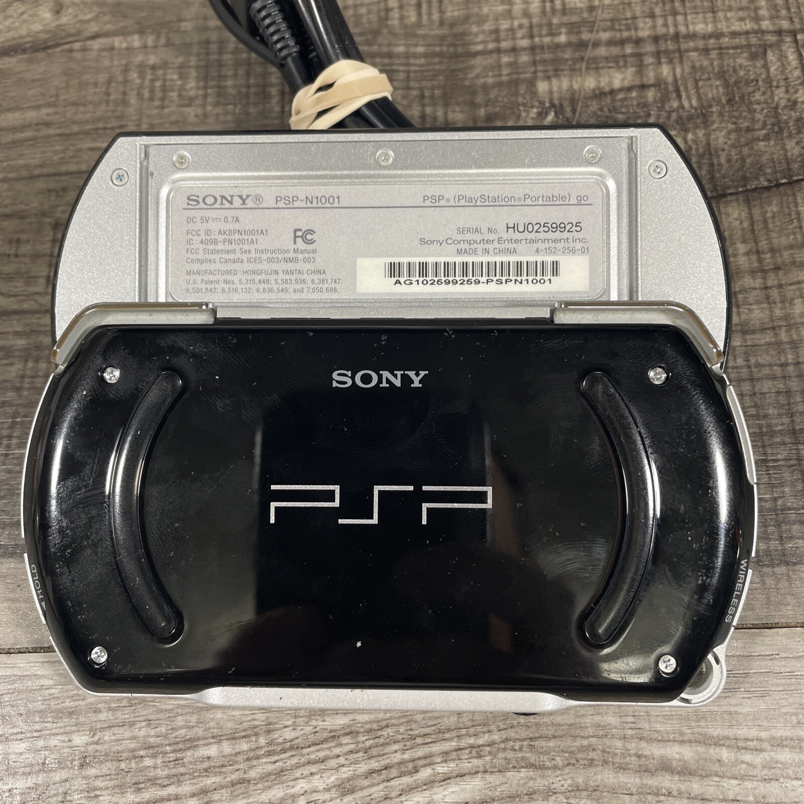 Sony PSP GO console Black with Charger PSP-N1001, Comes With Two Games