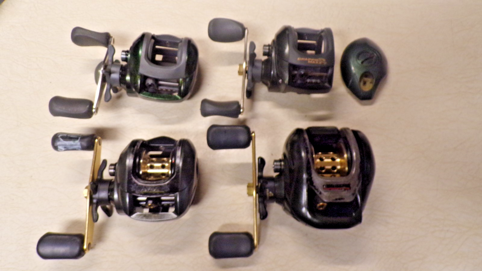 4 - BASS PRO SHOPS FISHING REELS - GREEN EXTREME - A LOT OF GOOD PARTS ...