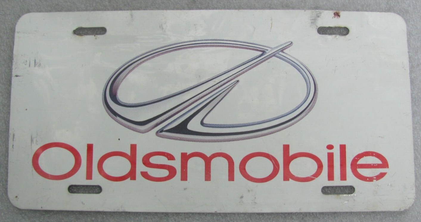 VINTAGE OLDSMOBILE DEALER VANITY LICENSE PLATE GENUINE OLDS EMBLEM SIGN ...
