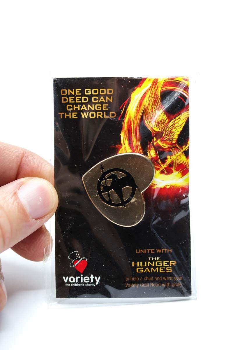 Hunger Games pin, Variety Children's Charity, unopened. | eBay