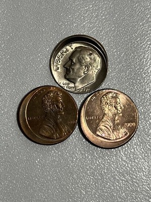 Off Center Coins With Dates: 1970 Dime, 2000P Penny, 2000P Penny. (#72 ...