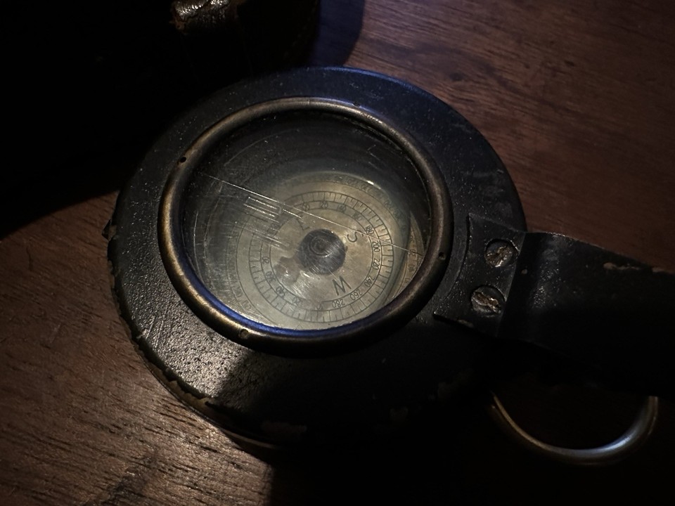 This is a World War II British Army prismatic compass, often referred ...