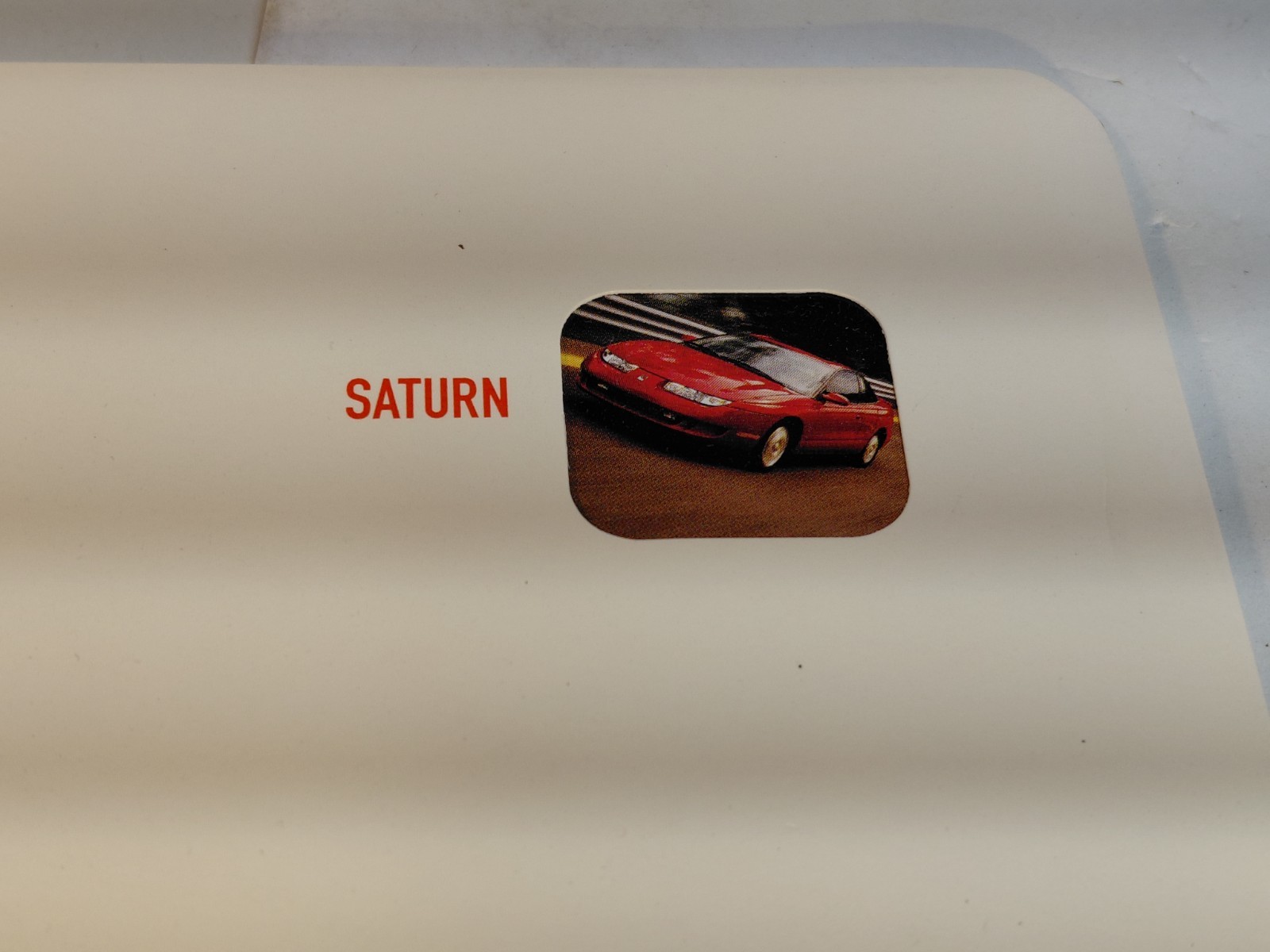 1998 Saturn brochure. New. 14 pages w foldout. A Different Kind of ...
