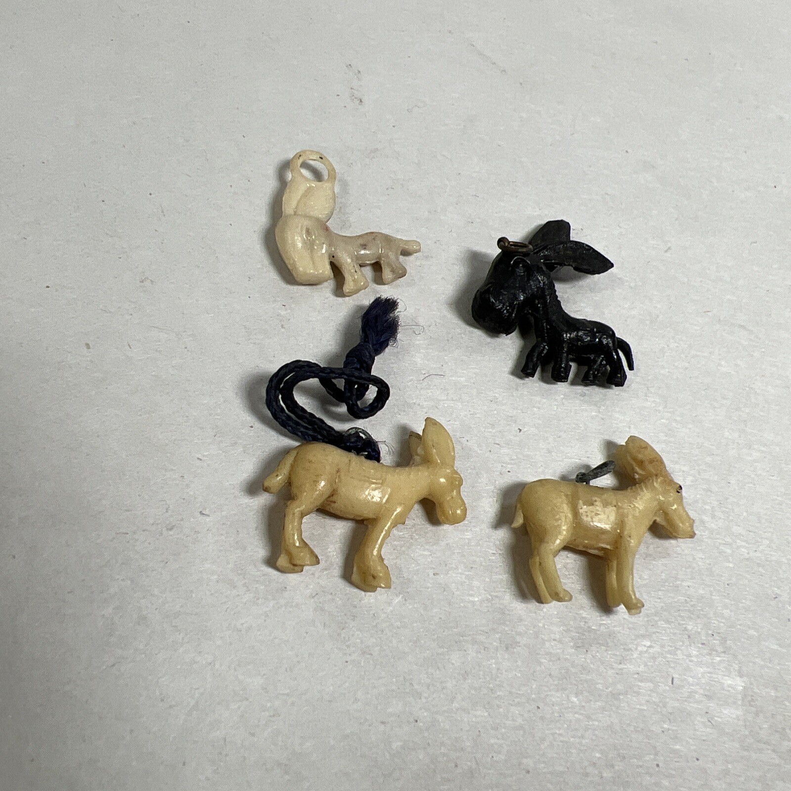 LOT OF 4 VINTAGE CELLULOID VARIOUS DONKEY MULE CHARMS CRACKER JACK TOY ...