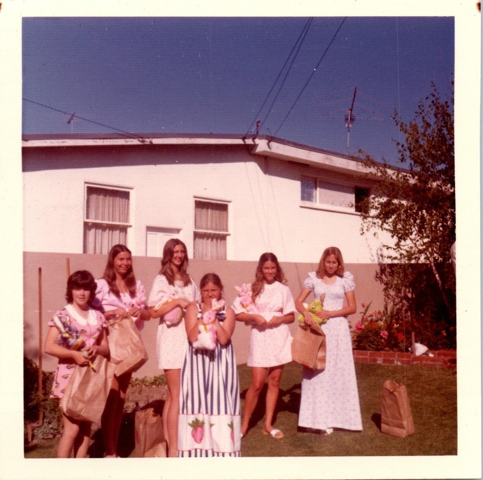 1970s Girls Holding Easter Bunnies in Dresses Backyard Scene Vintage ...