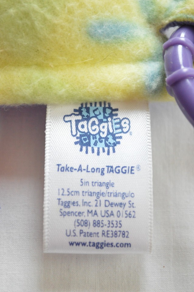 Take Along Taggies Triangle Plush Squeaks Flowers Yellow Purple Fleece ...