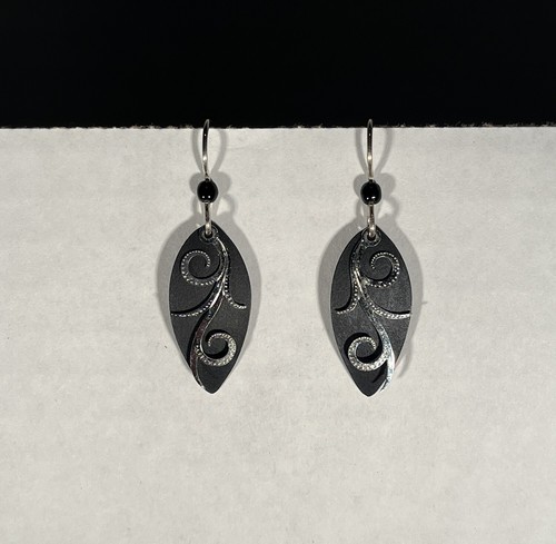Silver Color Pierced Earrings, Swirl Design Against Black Teardrop ...