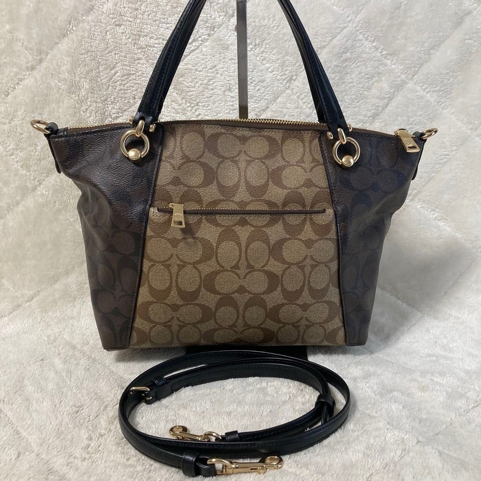 Borsa a tracolla Coach Casey 2 vie in pelle marrone con logo PVC nuova ...