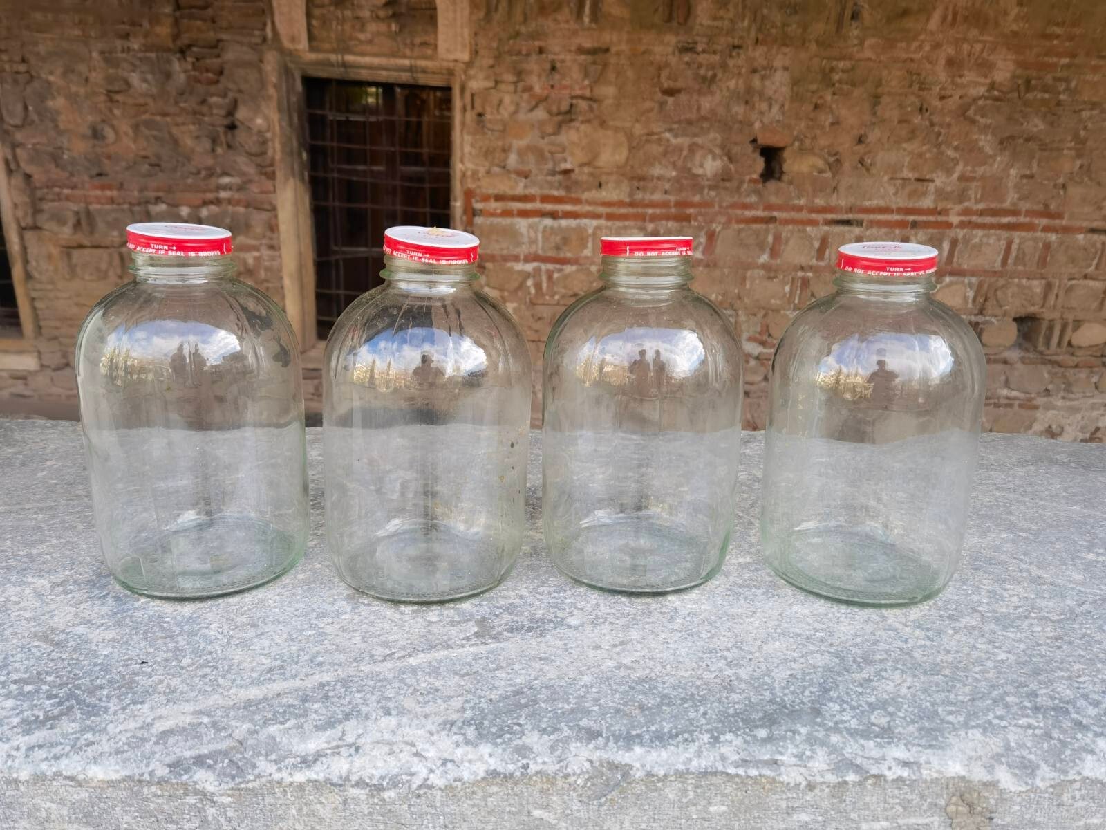 Four large bottles of Coca Cola, collectible Coca Cola concentrate ...
