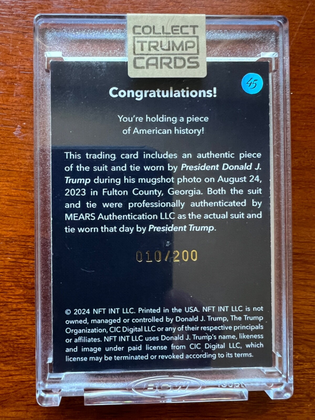 Official Collect Trump Cards physical card with piece of Mugshot suit ...