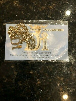 NEW Diamonds International charm bracelet gold with DI charm gold stone ...