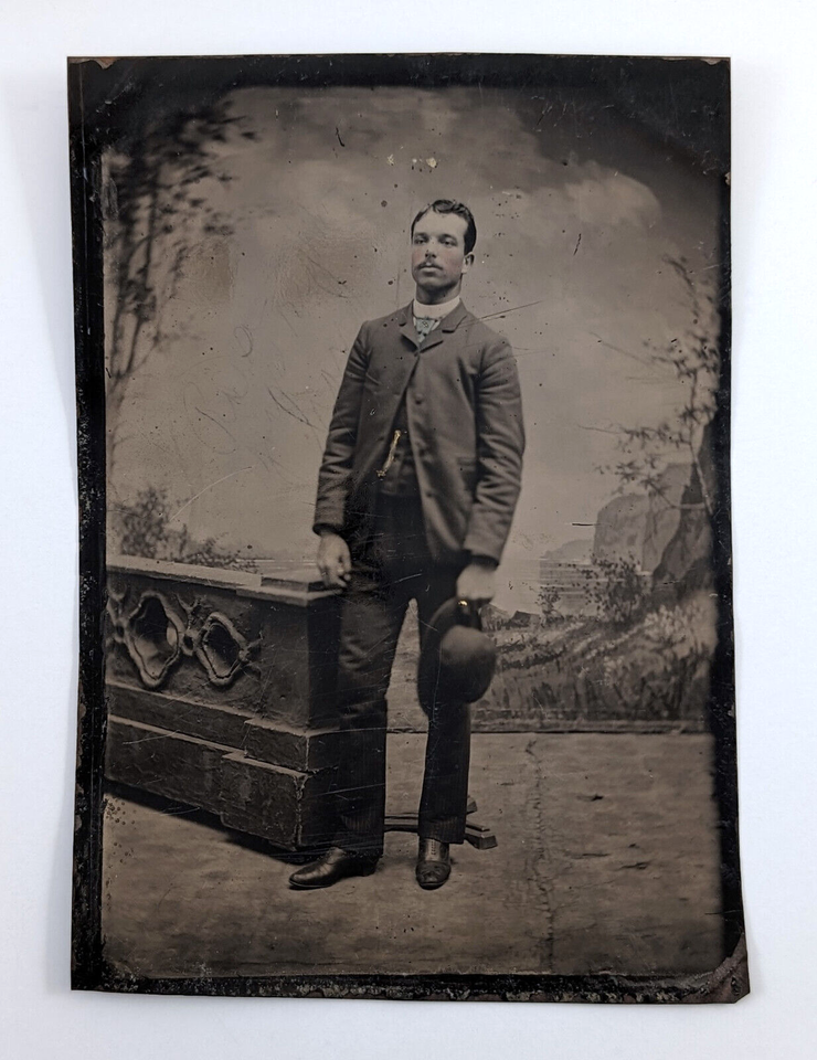 Tintype Photo Dapper Man Holding Hat Posing Stand Painted Backdrop | eBay