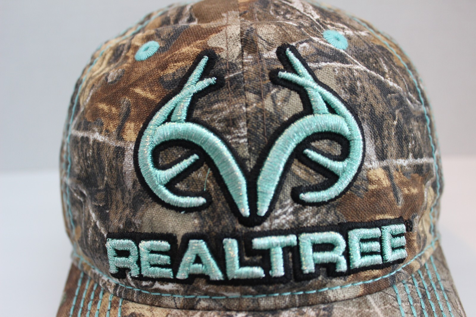RealTree Camouflage Hat Sea Foam Stitching and Metall… - Gem