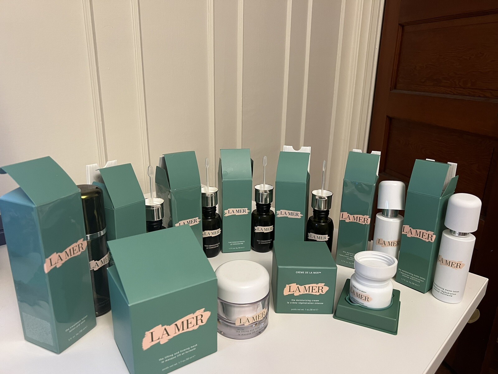 Multiple La Mer empty bottles and jars with original boxes (Description ...