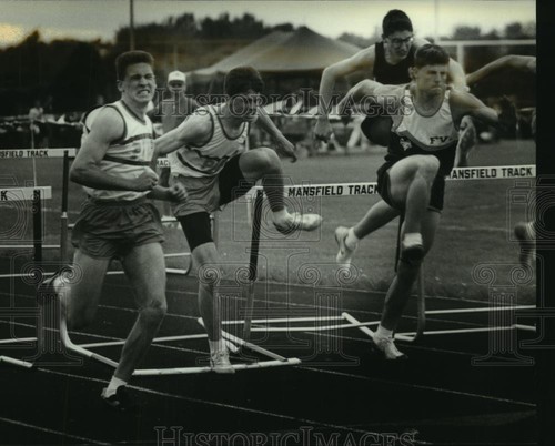 1993 Press Photo Brody Buss competes in 110-meter high hurdles in track ...
