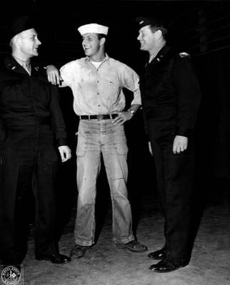 Whitey Kurowski and Red Barrett are greeted by their former teamma- Old ...