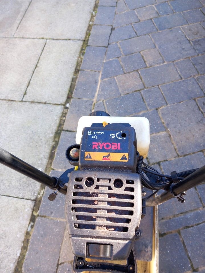 The Ryobi 410R is a lightweight, gasoline-powered 2-stroke mini-tiller ...