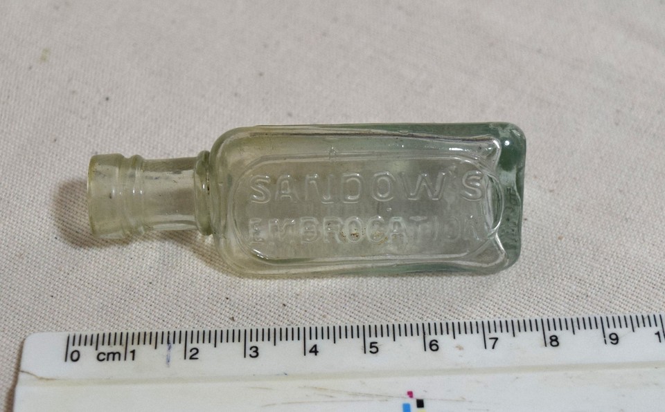 SANDOWS'S EMBROCATION. Triangle shaped bottle very small. (sample) | eBay