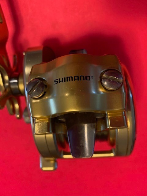 SHIMANO TRINIDAD TN 16 GOLD CONVENTIONAL FISHING REEL + GOLD SHIMANO ...