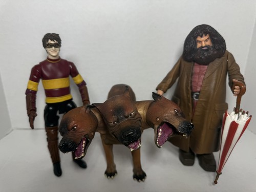 Harry Potter action figures, including Hagrid and Fluffy the three ...
